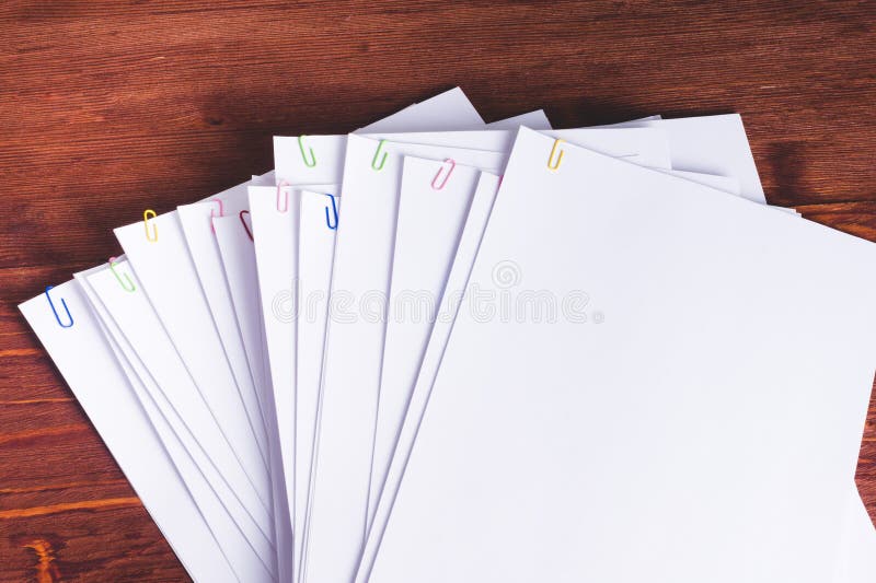 Stack of White Papers with Paper Clips on Office Table Stock Photo ...