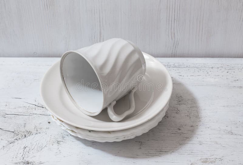 Stack of White Plates and Cup on Table Stock Photo - Image of concepts ...