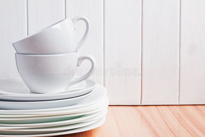 Stack of White Plates and Cups on the Wooden Stock Image - Image of ...