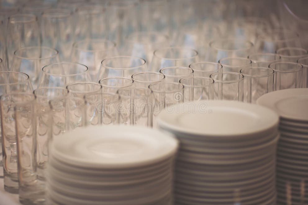 Stack of White Plates in the Restaurant. Table with Plates in ...