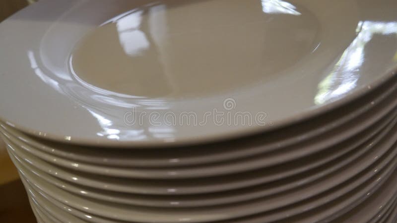 Stack of White Plates on a Shelf in a Restaurant, Shallow Depth of ...