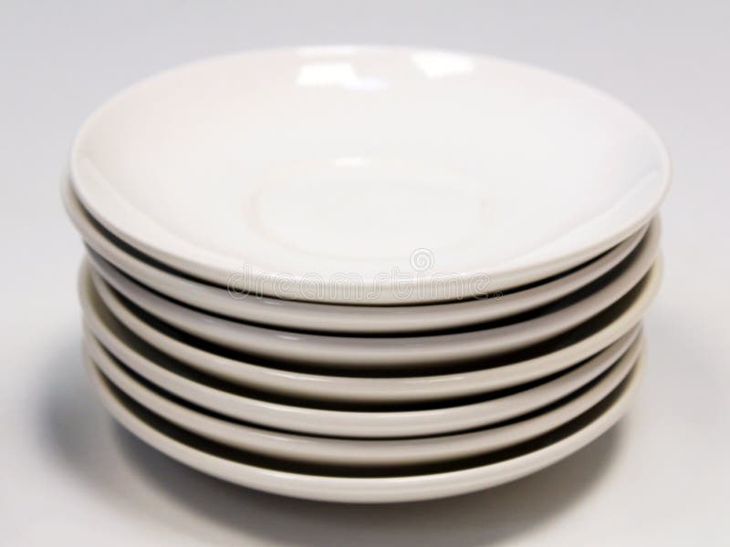 A Stack of White Plates on a White Background Stock Photo - Image of ...