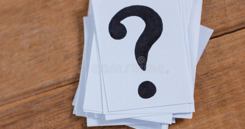 Stack of White Sheets of Paper with Question Mark Signs on Wooden Table ...