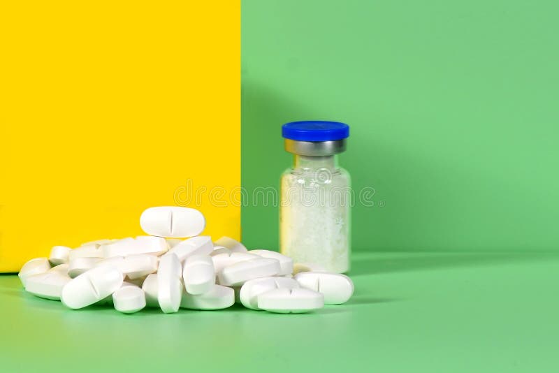 Stack of White Tablets and Medical Vial Medicinal Powder for Saline ...