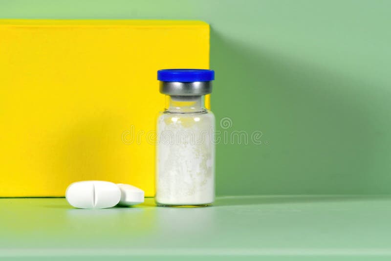 Stack of White Tablets and Medical Vial Medicinal Powder for Saline ...