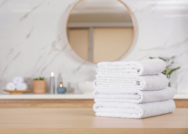Stack of White Towels on Wooden Table in Bathroom Stock Photo - Image ...