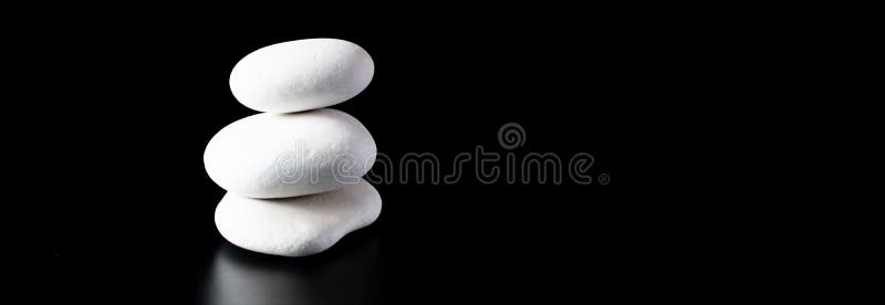 Stack of 3 White Zen Rocks Piled Up on a Black Background Stock Photo ...