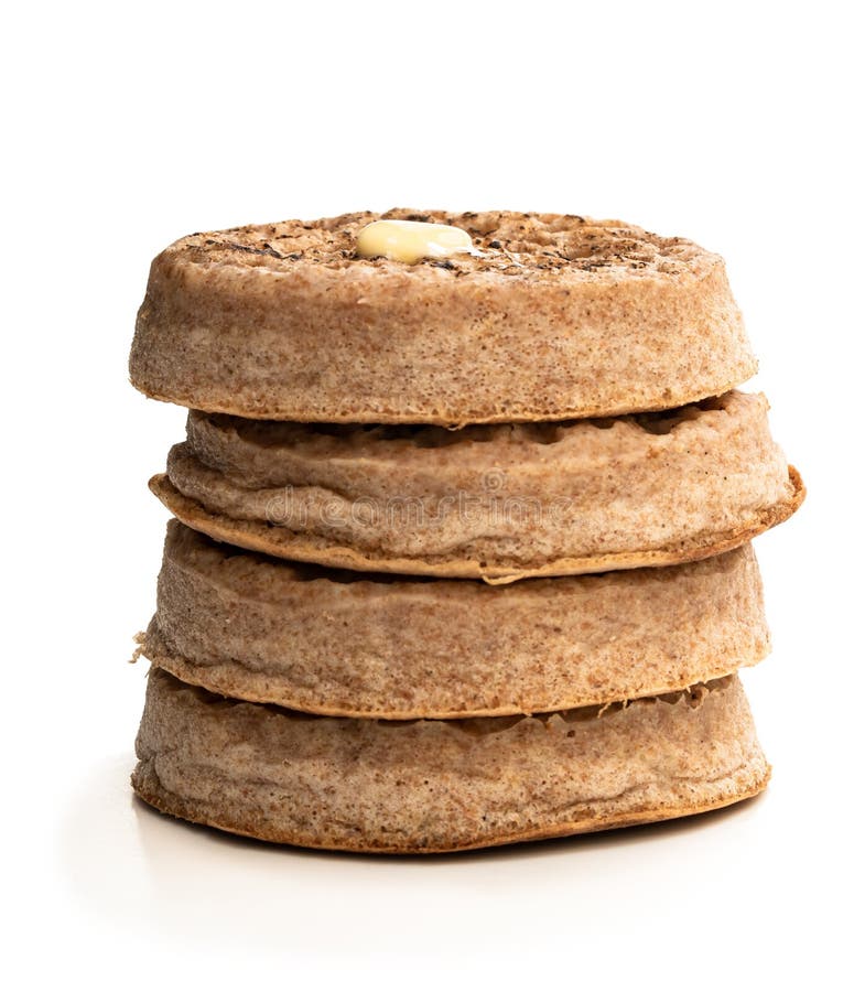 Giant Crumpets with Melted Butter on Cutting Board Isolated on White ...