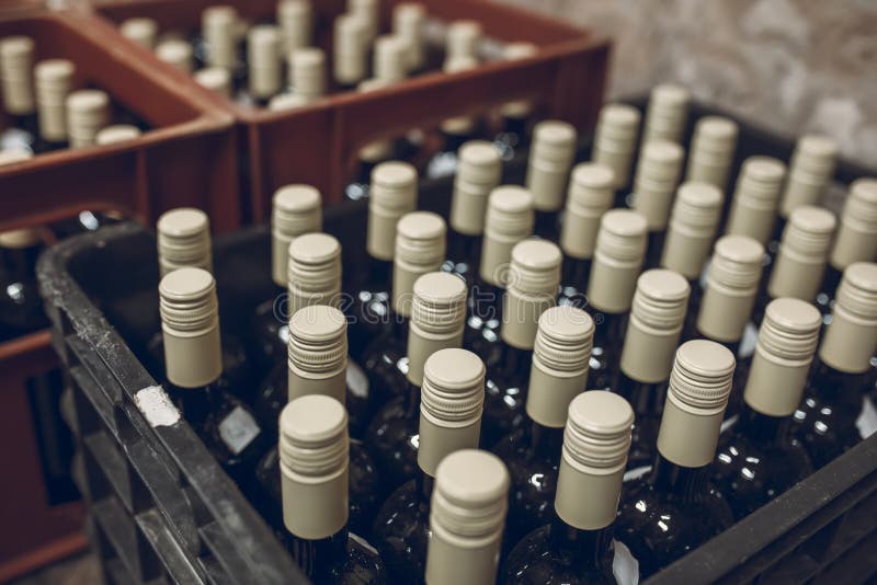 Stack of Wine Bottles in Cellar Stock Photo - Image of black ...