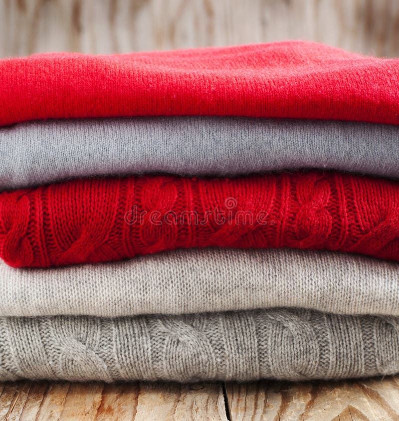 Stack of Women S Sweaters in Grey and Red Colors Stock Photo - Image of ...