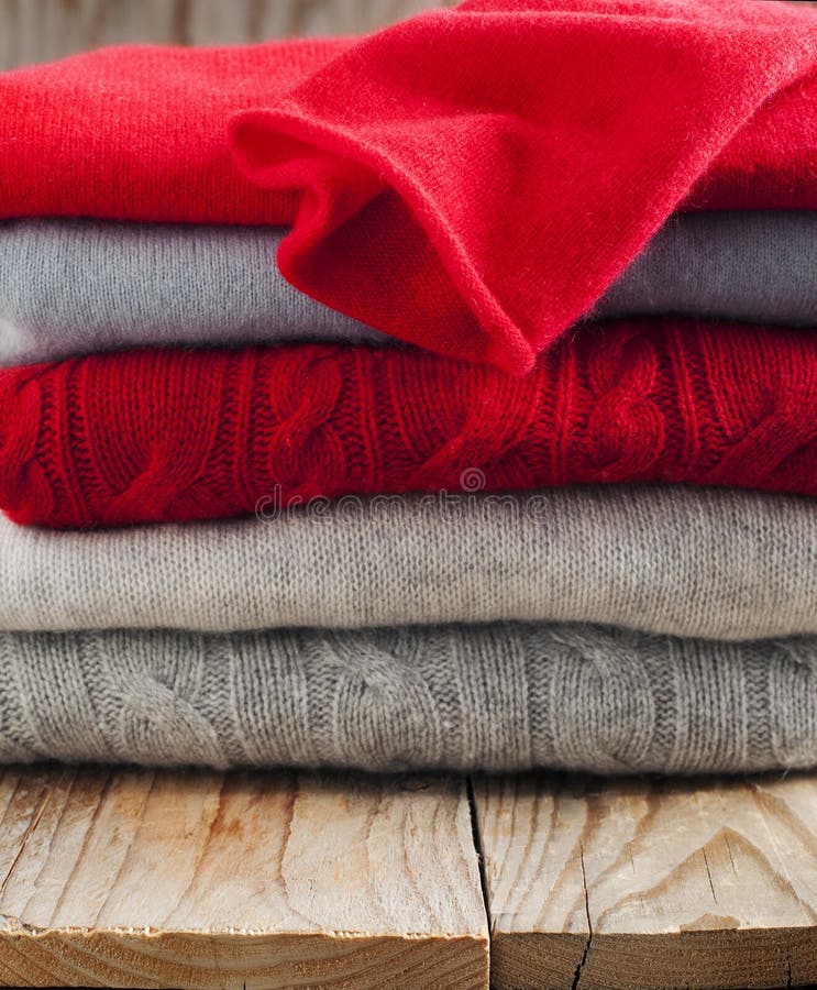 Stack of Women S Sweaters in Grey and Red Colors Stock Photo - Image of ...