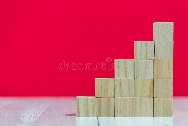 Stack of Wood Cube Building Blocks on Red Background Stock Photo ...