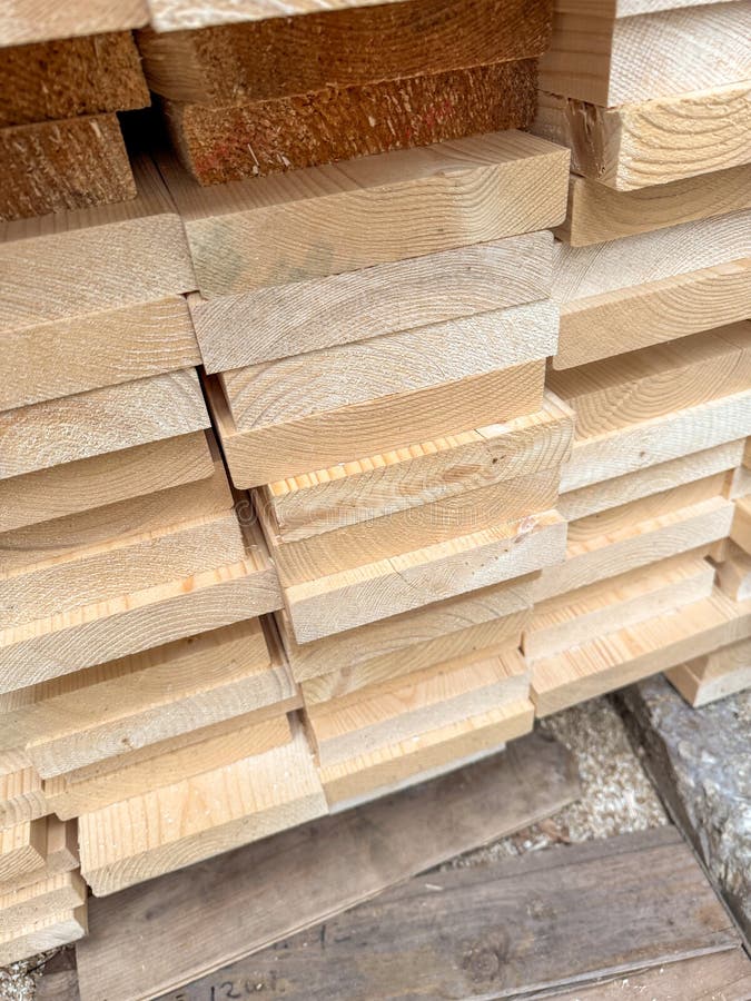 A Stack of Wood Planks with a Few of Them Being Cut Stock Photo - Image ...