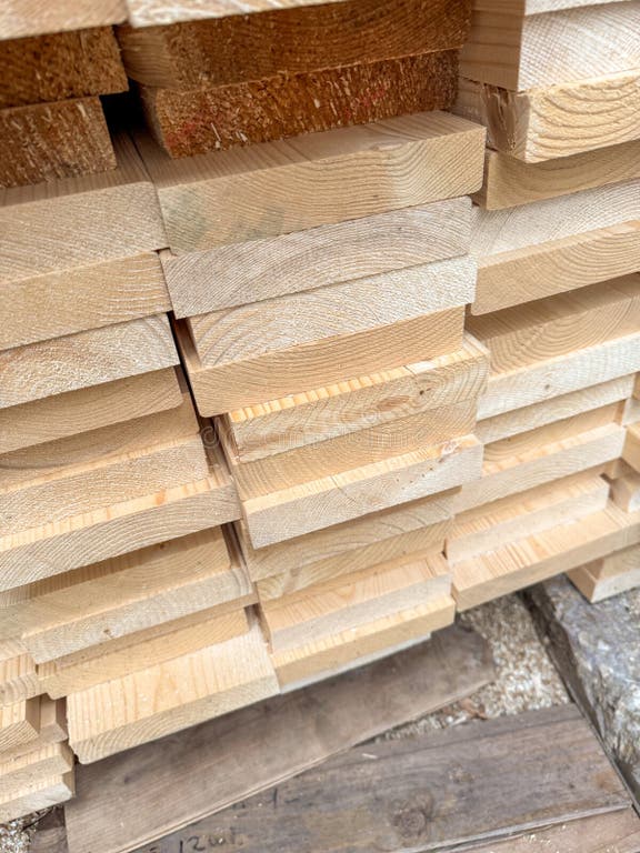 A Stack of Wood Planks with a Few of Them Being Cut Stock Photo - Image ...