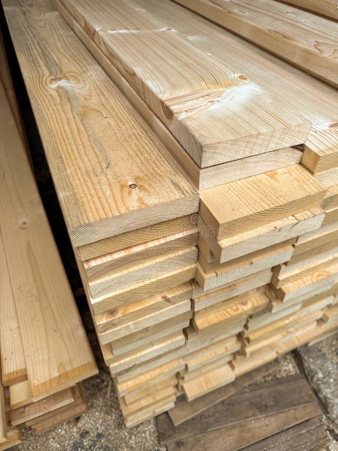 A Stack of Wood Planks with a Few of Them Being Cut Stock Photo - Image ...