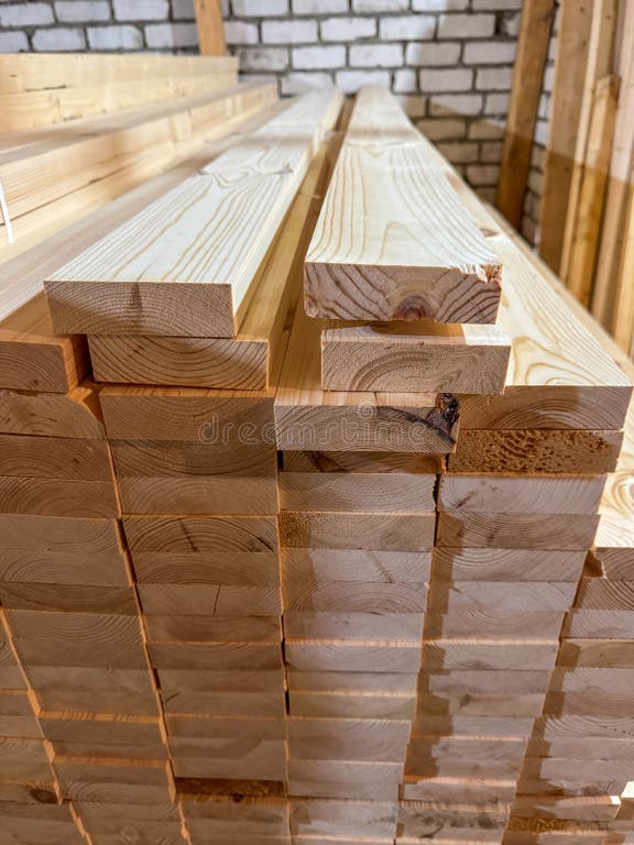 A Stack of Wood Planks with One of Them Cut in Half Stock Image - Image ...