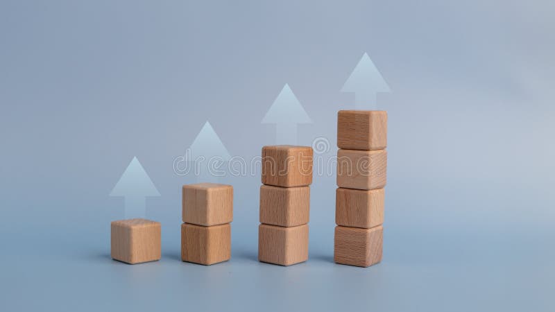 A Stack of Wooden Blocks with a Blue Background and an Arrow Pointing ...