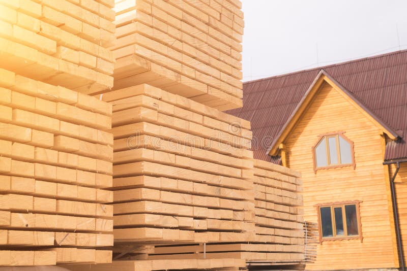 Stack of Wooden Material for Building. New Big Wooden House Stock Photo ...