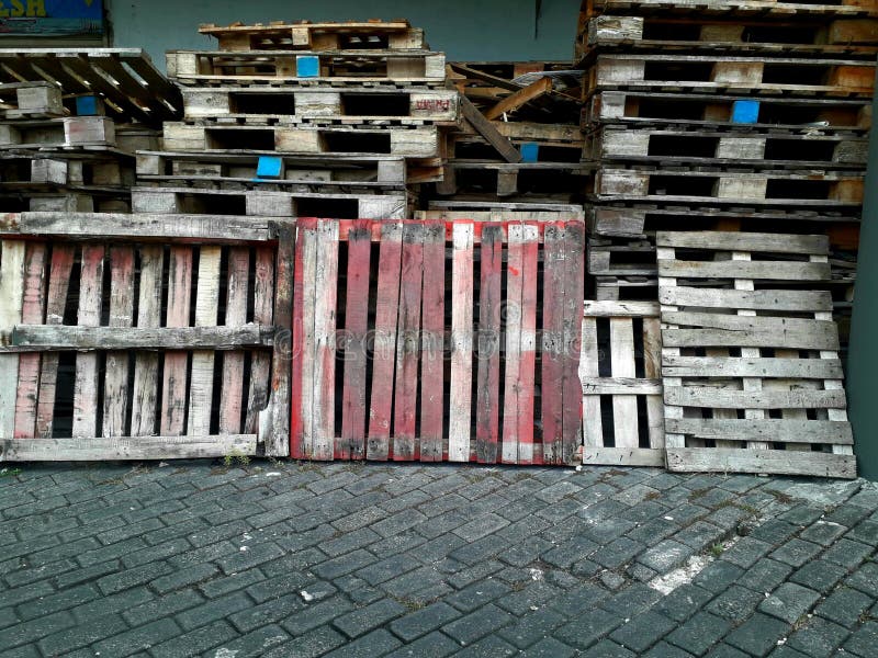 Stack of Wooden Pallets in the Groceries Store Stock Photo - Image of ...