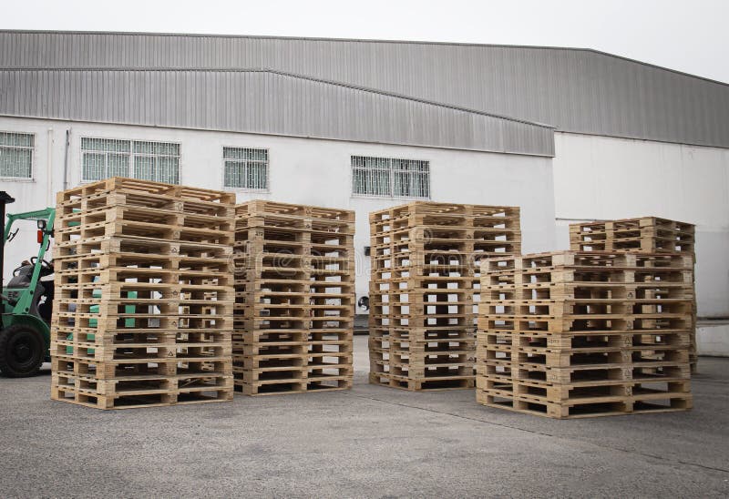 Stack of Wooden Pallets for Loading Cargo Shipment with a Truck Stock ...