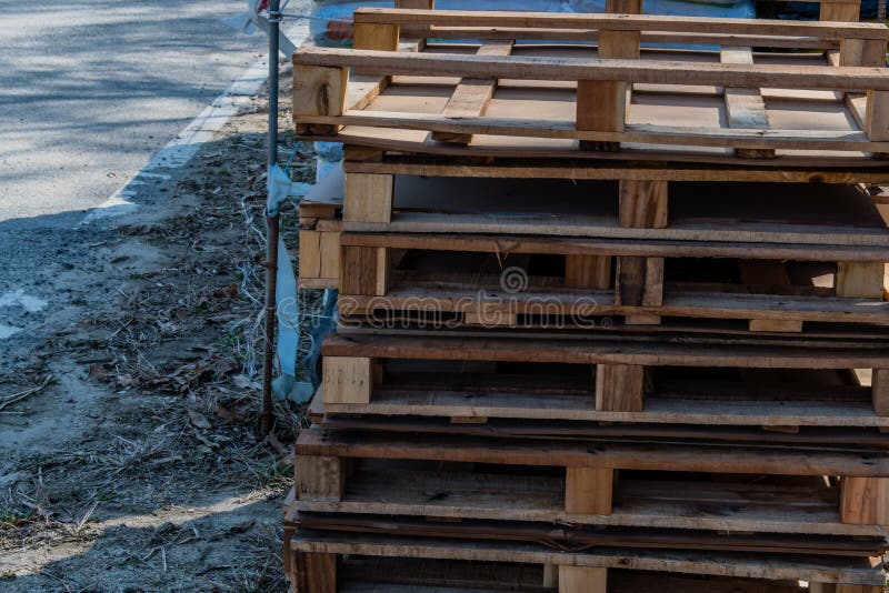 Stack of wooden pallets stock photo. Image of paved - 175577610