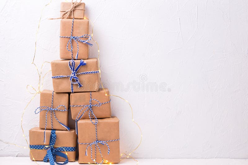 Stack of Wrapped Boxes with Presents and Fairy Lights on White Stock ...