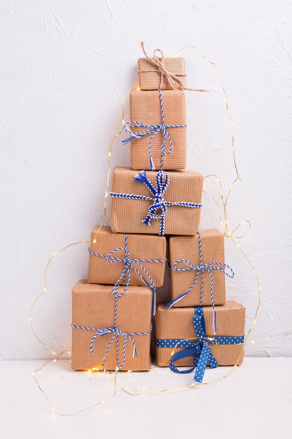 Stack of Wrapped Boxes with Presents and Fairy Lights on White Stock ...