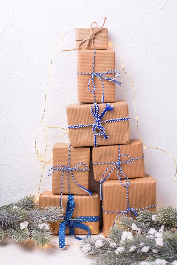 Stack of Wrapped Boxes with Presents, Fir Tree Branches and Fair Stock ...