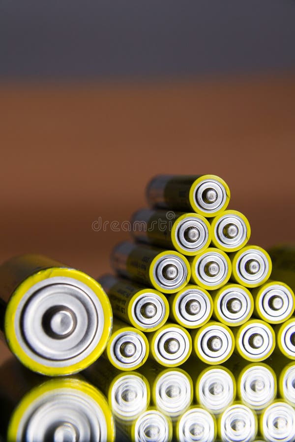 Stack of Yellow AA Batteries Close Up Abstract Coloured Background ...