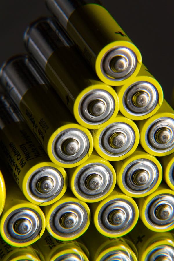 Stack of Yellow AA Batteries Close Up, Electricity Storage Concept ...