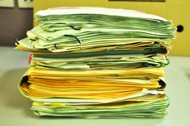 Stack of Yellow Folders on the Table Stock Photo - Image of open ...
