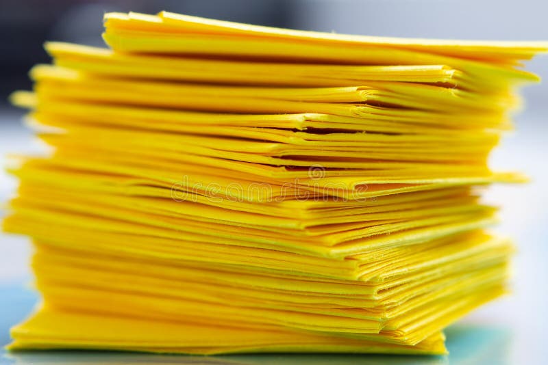 Stack of Yellow Paper on Blue Table Stock Photo - Image of financial ...