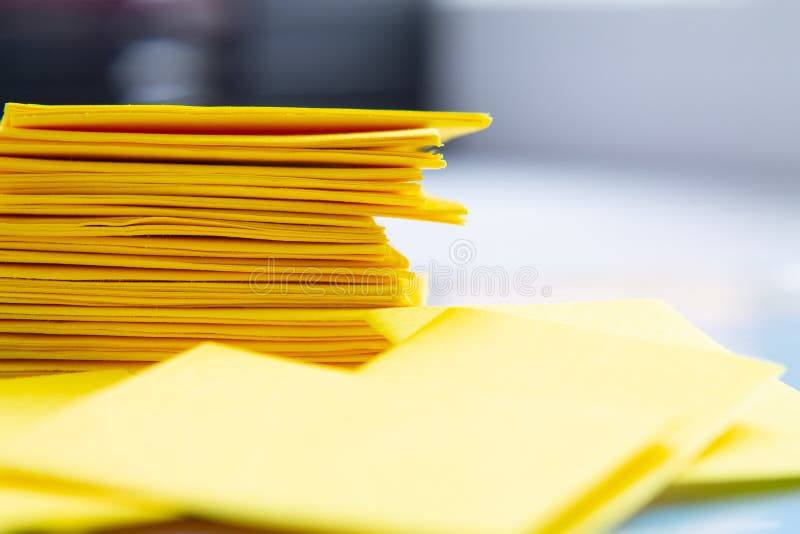 Stack of Yellow Paper on Blue Table Stock Photo - Image of invoice ...