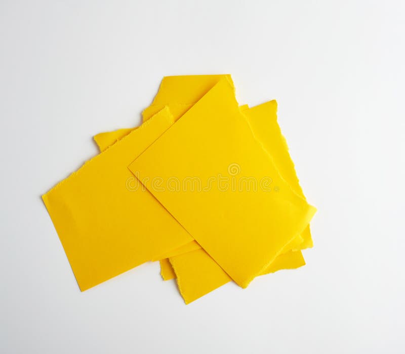 Stack of Yellow Paper Torn Pieces of Paper on a White Background Stock ...