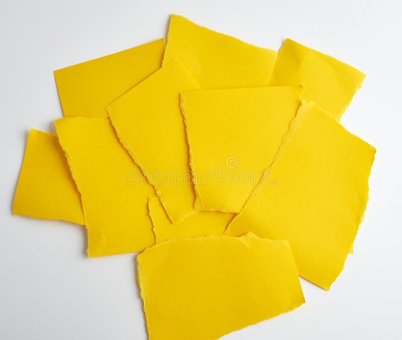 Stack of Yellow Paper Torn Pieces of Paper on a White Background Stock ...