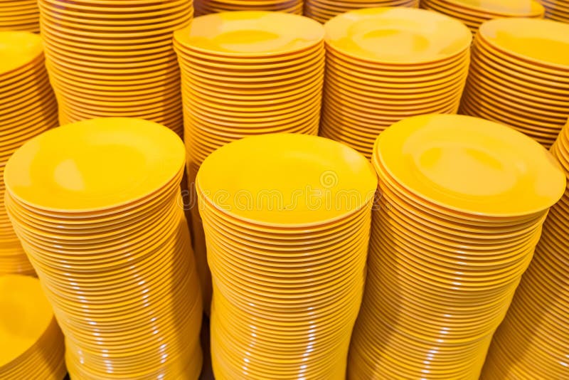 Stack of Yellow Plate in a Grilled Buffet Restaurant in Thailand Stock ...