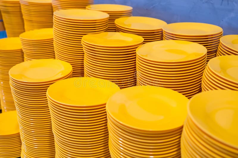 Stack of Yellow Plate in a Grilled Buffet Restaurant in Thailand Stock ...