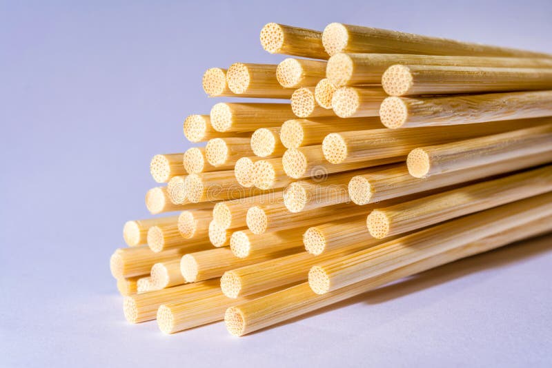 Stack of Yellow Wooden Sticks on Blue Background Stock Image - Image of ...