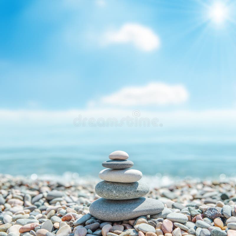 Stack of Zen Stones Near Sea and Clouds with Sun Stock Image - Image of ...