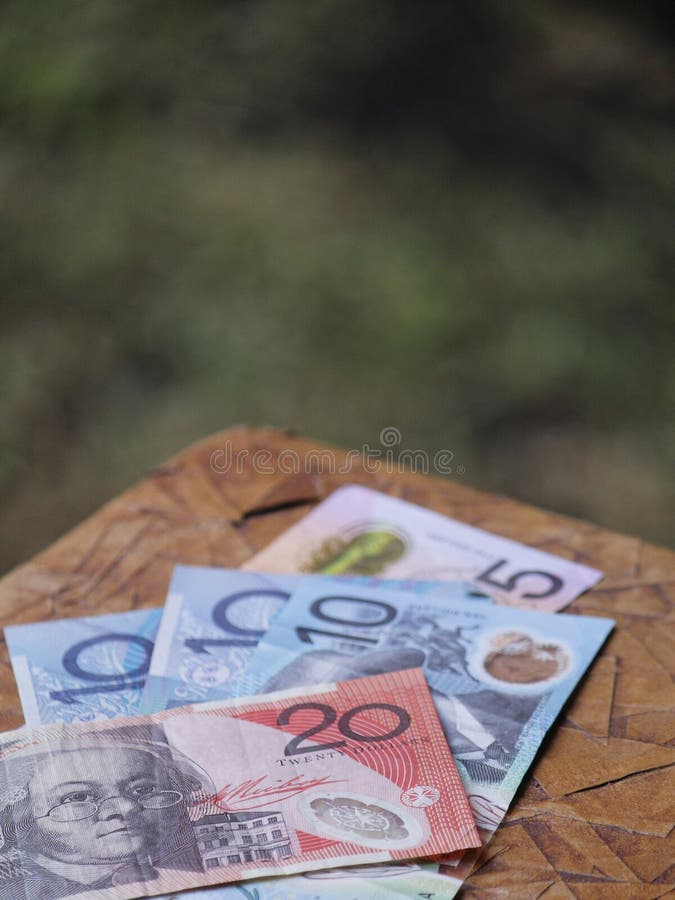 Stacked Australian Banknotes of Different Denomination on the Brown ...