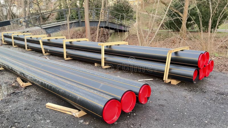 The Stacked Black Pipes with Vibrant Red Ends are Awaiting Their ...