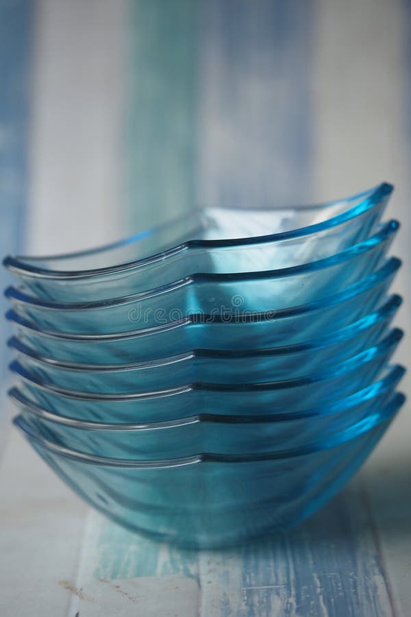 Stacked Blue Glass Bowls in a Clean Setting Stock Image - Image of ...