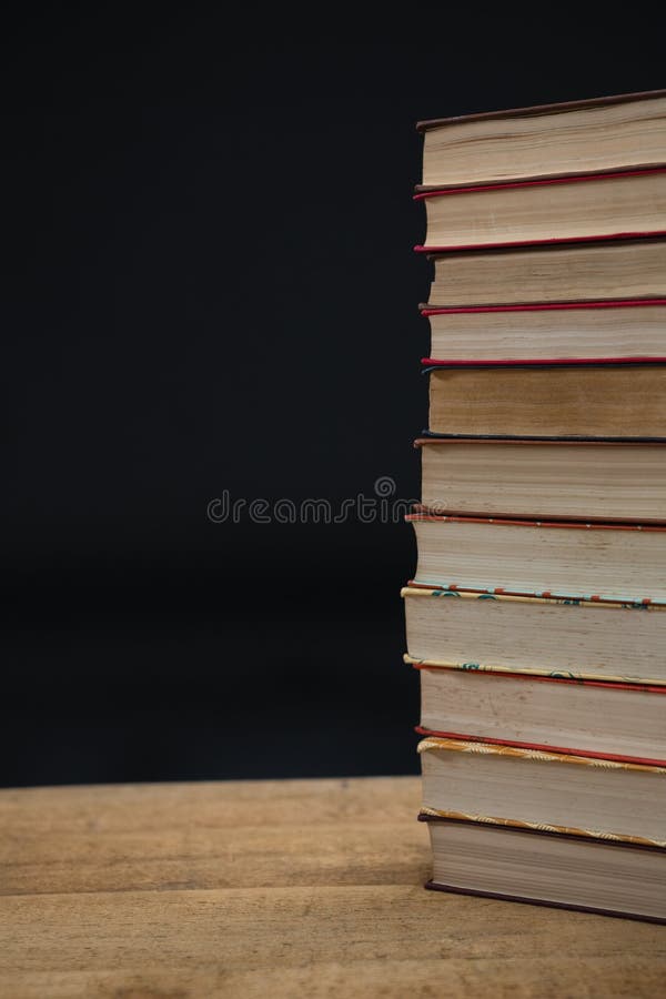 Stacked Books on Wooden Table Stock Photo - Image of copy, black: 96364918