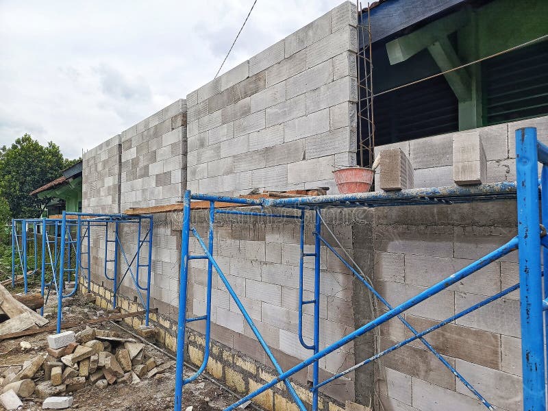 Stacked Bricks, Construction Materials, and Tools, Creating a Clean and ...