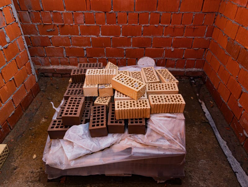 Stacked Bricks in the House during Construction. Stacks of Bricks in ...
