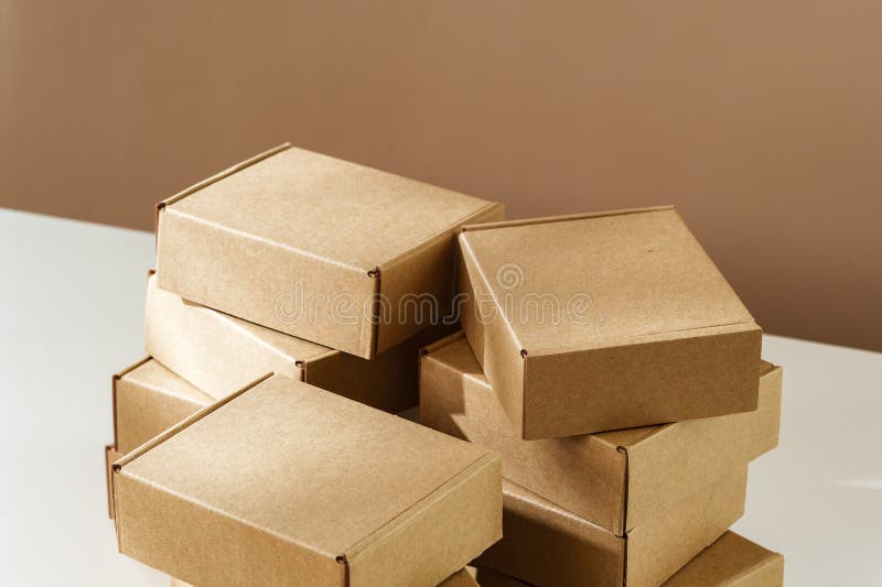 Stacked Brown Cardboard Boxes on White Surface Close Up Stock Image ...