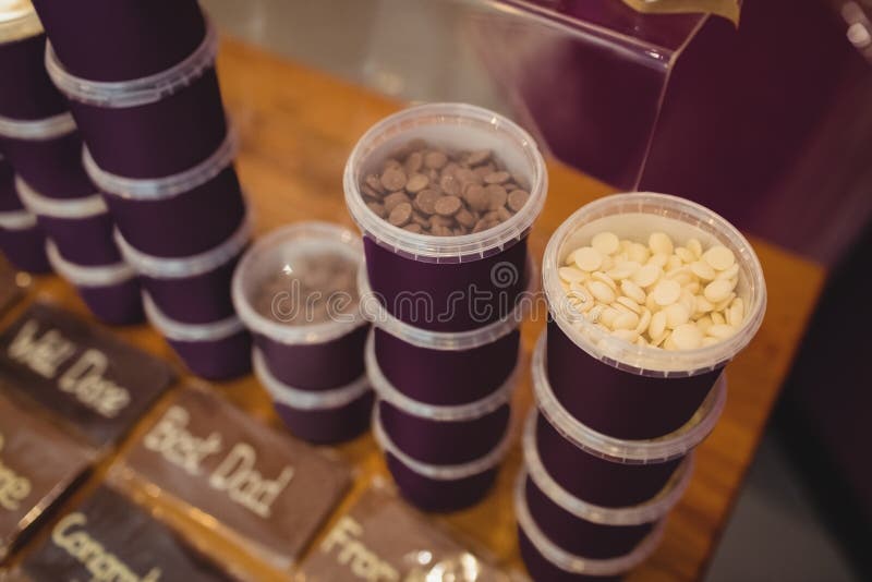 Stacked Chocolate Containers in Display Stock Photo - Image of people ...