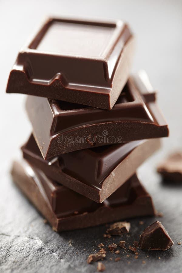 Stacked chocolate pieces stock photo. Image of chocolate - 35663482