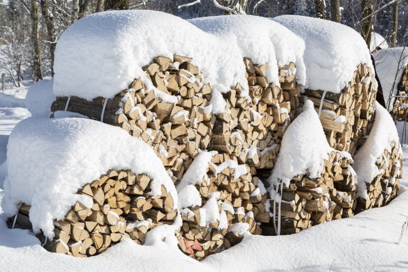 Stacked Chopped Firewood Covered by Snow in Winter Stock Photo - Image ...