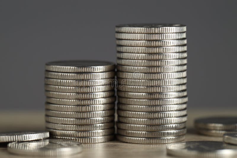 Stacked Coins on Table Against Grey Background, Closeup. Salary Concept ...